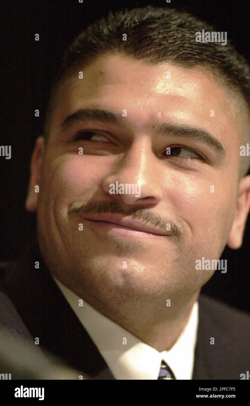WBA/North American heavyweight champion John Ruiz smiles as he listens ...