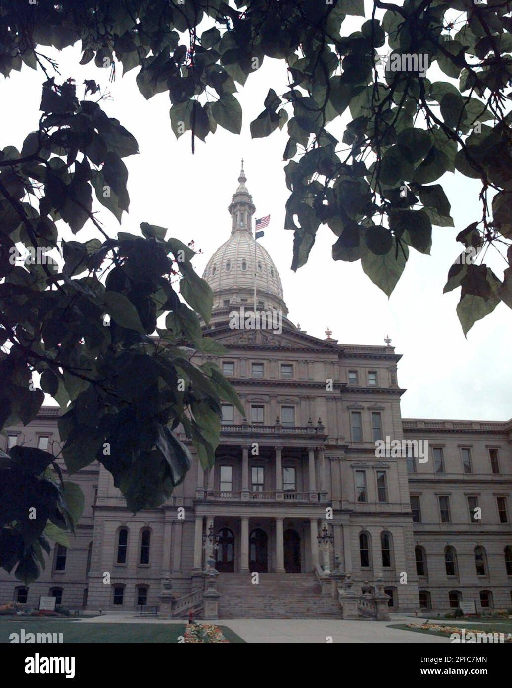 The dome of the State Capitol Building in Lansing, Mich., if framed by ...