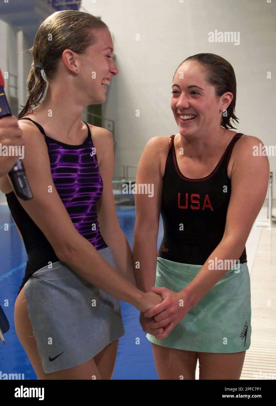 Laura Wilkinson of The Woodlands, Texas, left, shares a laugh with Sara ...