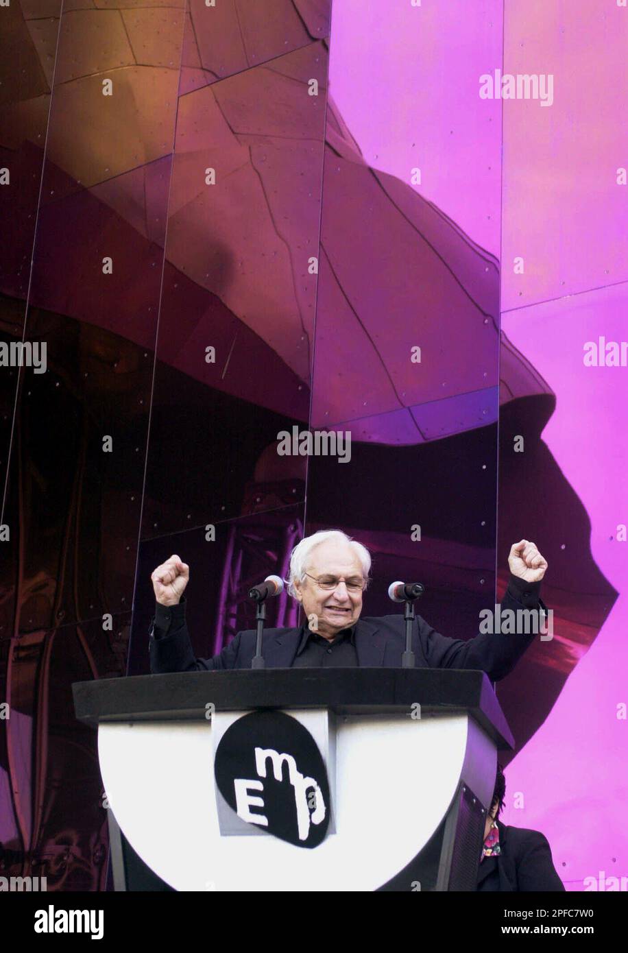 World-renowned architect Frank Gehry raises his arms in exaltation ...