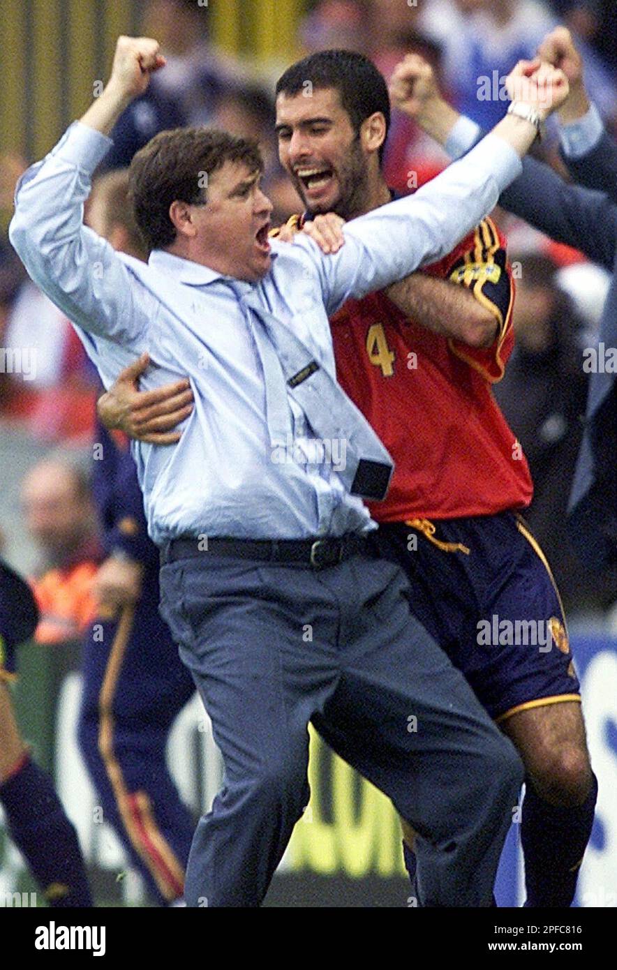 Spanish coach Jose Antonio Canacho celebrates with his player Guardiola ...