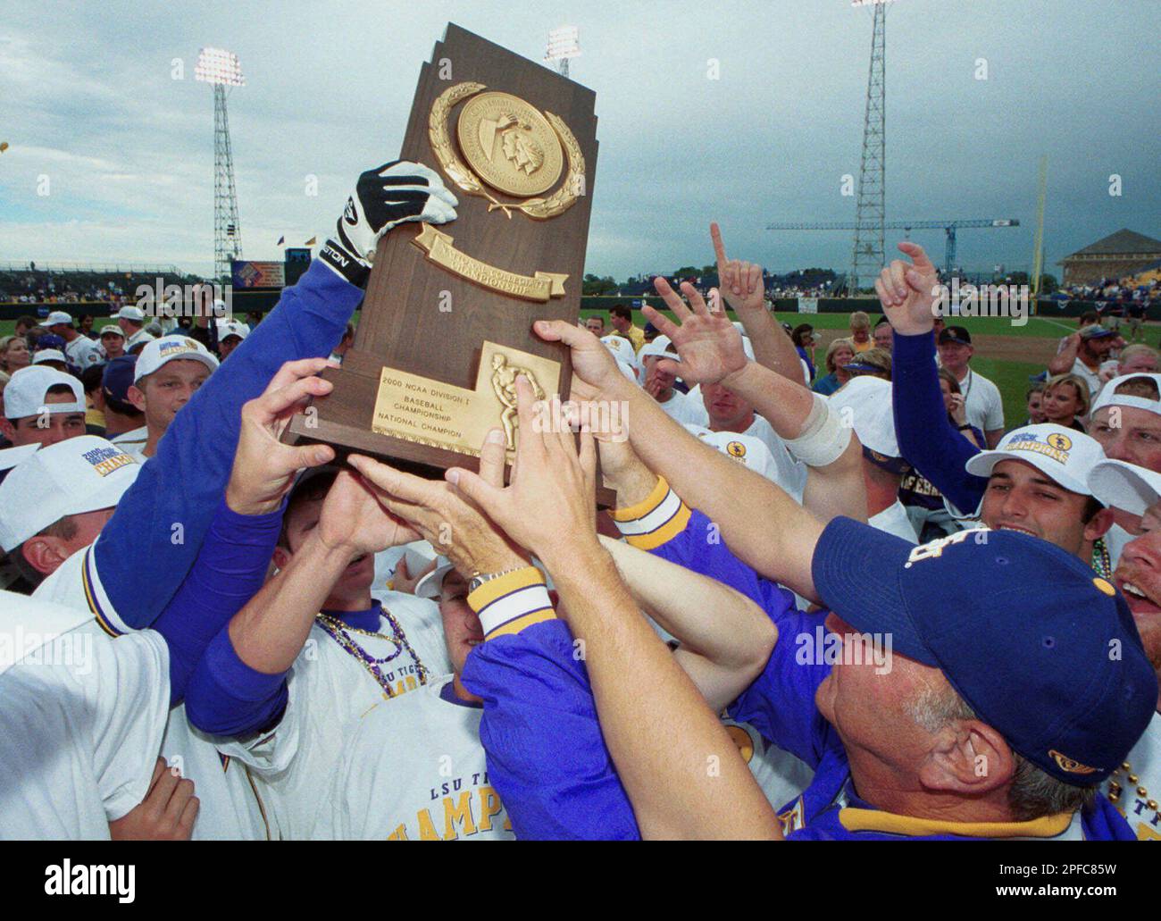 Louisiana State coach Skip Bertman, bottom right, reaches for the ...