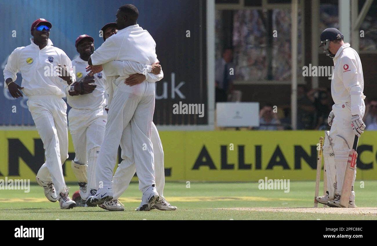 West Indies fast bowler Reon King, right in left group, celebrates his ...