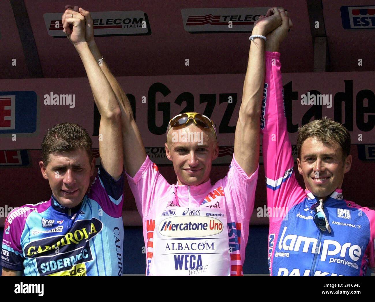 Italy's Stefano Garzelli, center, celebrates with runnerup Francesco ...