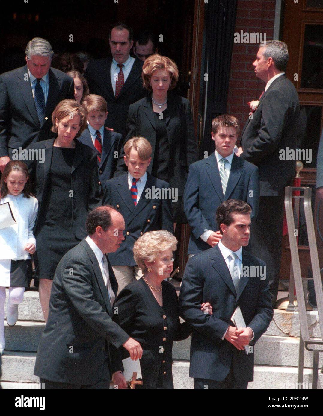 The Casey family, including widow Ellen Casey, center, exit St. Peter's ...