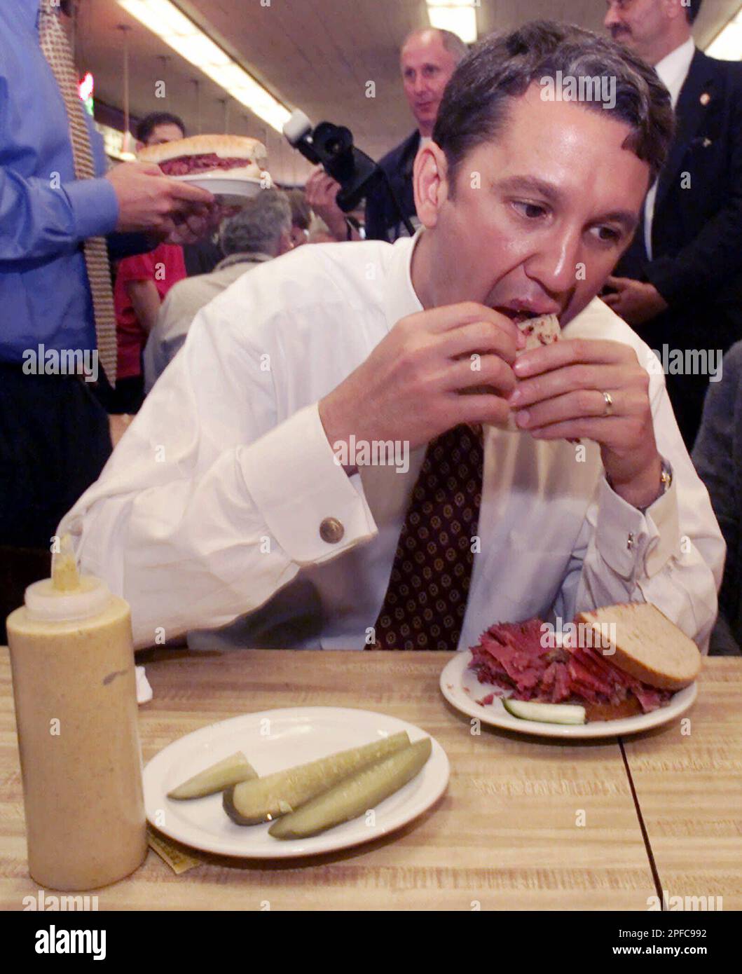 U.S. Senate candidate Rick Lazio, R-NY, bites into his corned beef ...