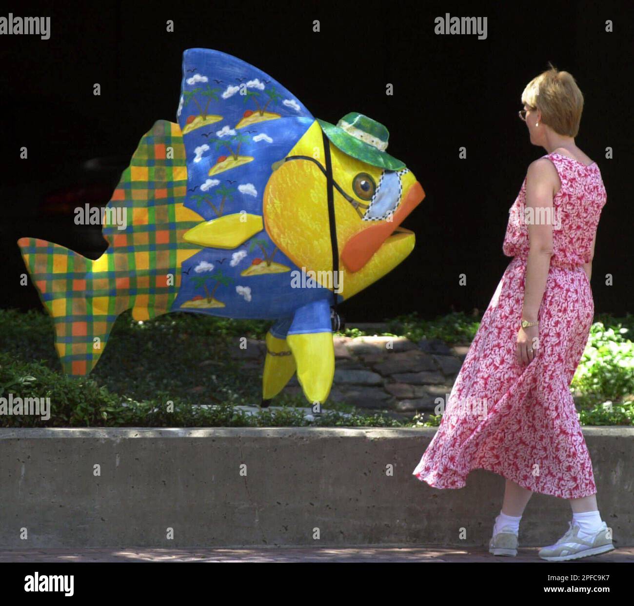 Cheryl Wall pauses to admire a fish sculpture in front of the Louisiana ...