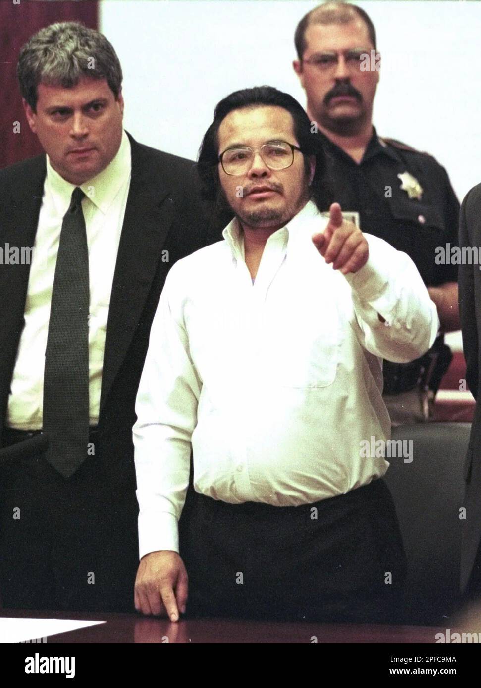 Convicted railroad killer Angel Maturino Resendiz, center, points his ...