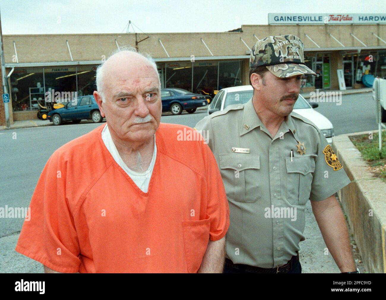 Gordon Winrod is escorted to an arraignment hearing Wednesday, May 17 ...