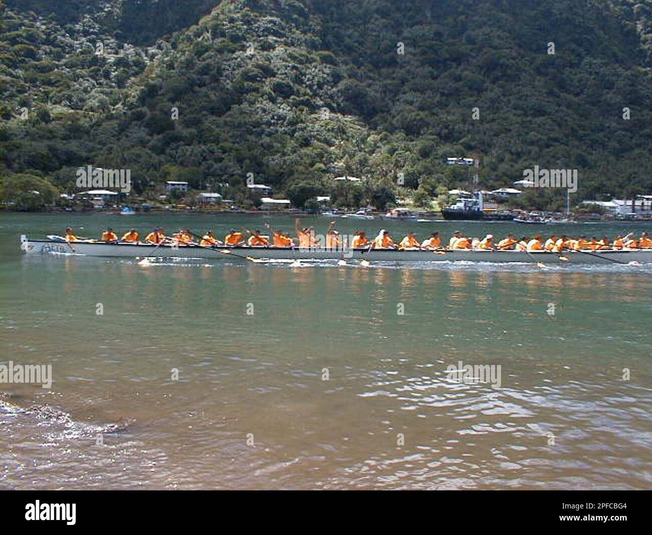 Participants in American Samoa's Flag Day celebration row into Utulei ...