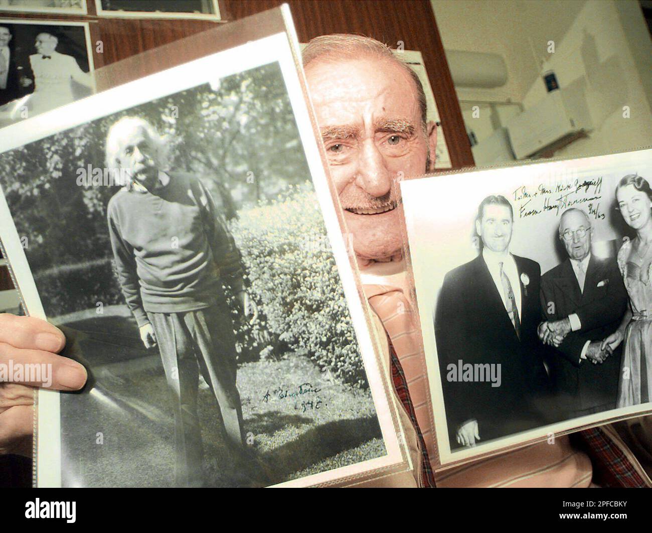 Nicholas Georgieff shows off some of his famous photographs at his home ...