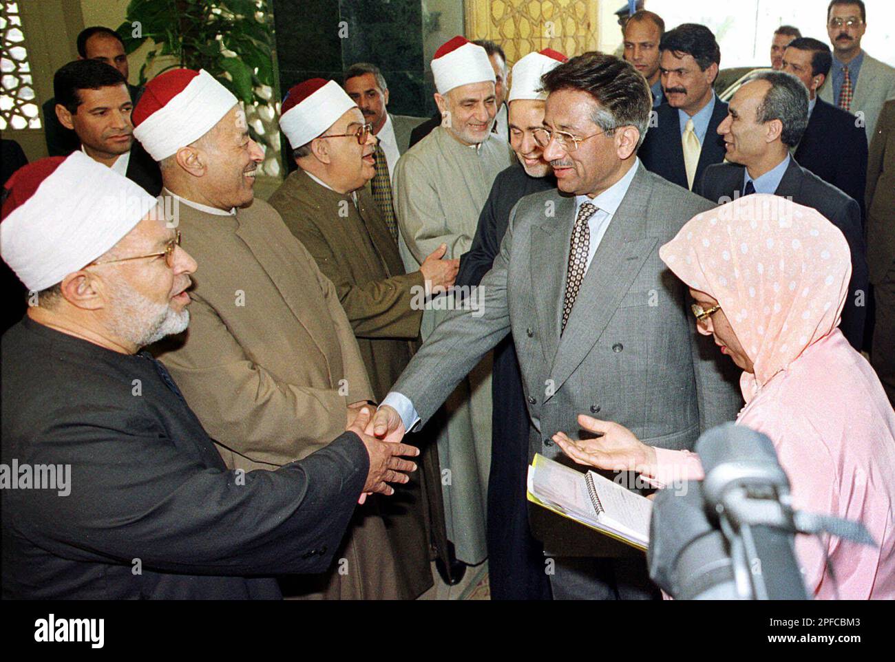 Pakistan's military ruler Gen. Pervez Musharraf, right, is welcomed by ...