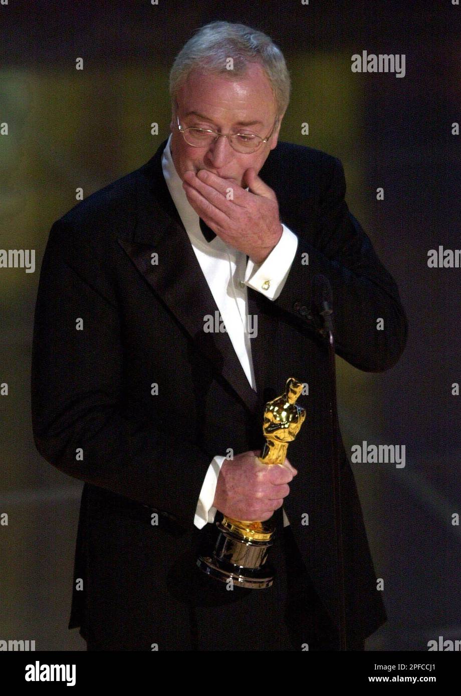 Michael Caine reacts before his acceptance speech for best supporting ...