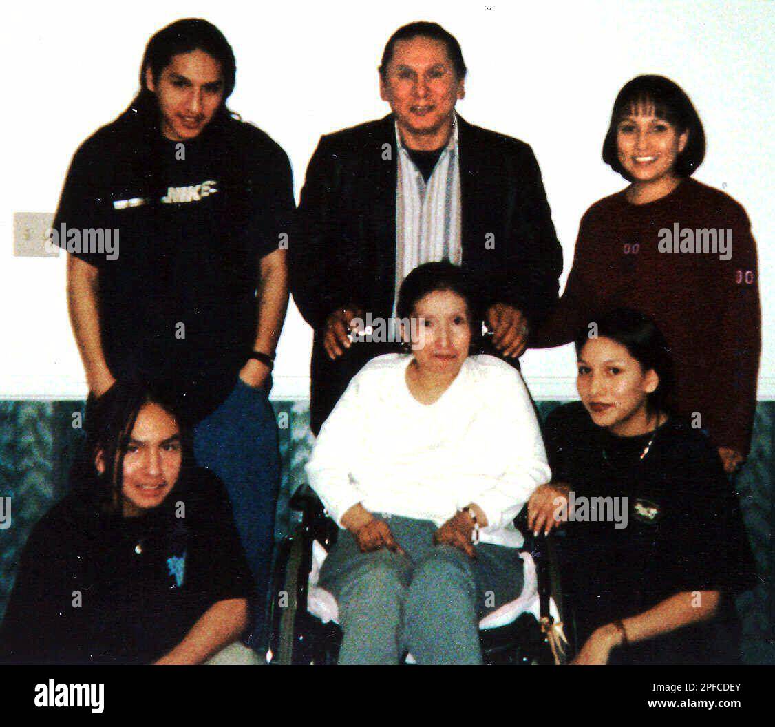 Members of Patricia White Bulls', in wheelchair, family pose in this ...