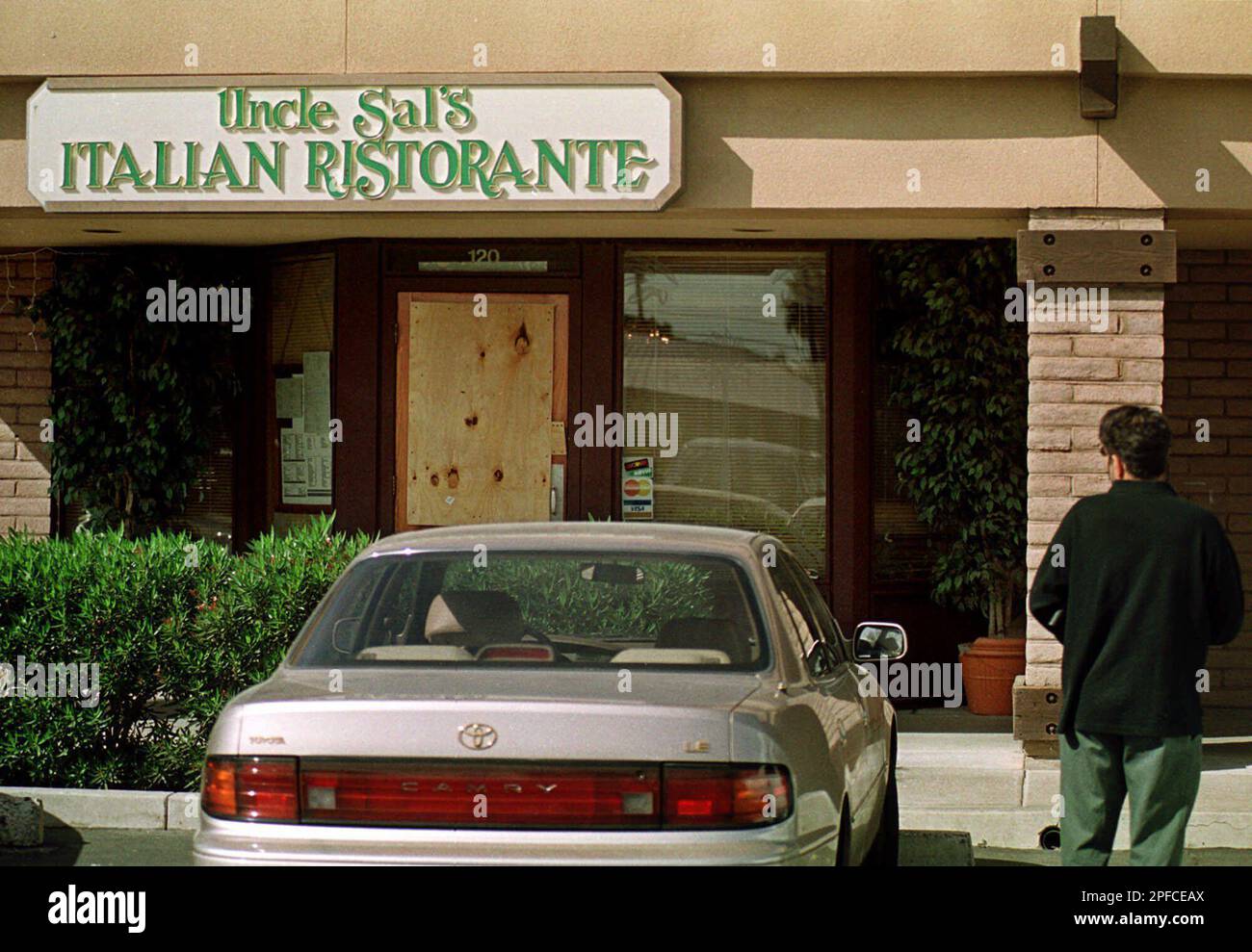 An unidentified customer approaches the "Uncle Sal's Italian Ristorante ...