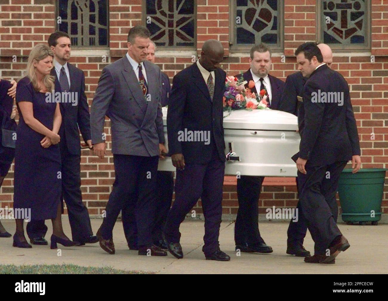 Christy Robel, left, and her husband Greg Robel follow the body of ...