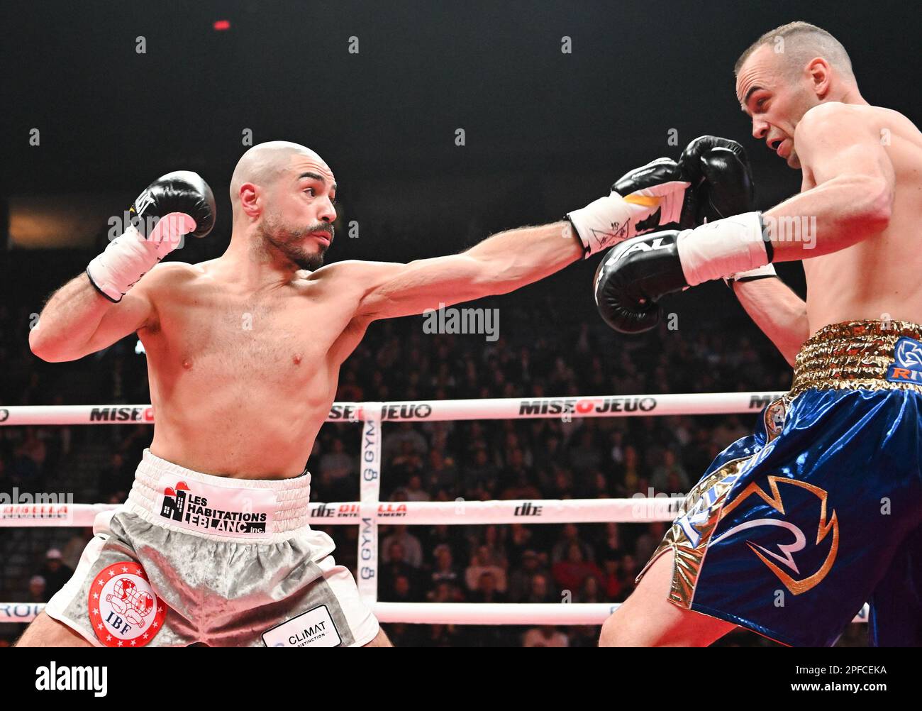 Laval, Canada. 16th Mar, 2023. Mathieu Germain of Canada, left, trades ...