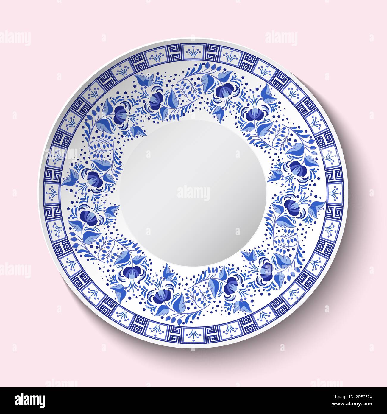 Blue ornament with flowers on the edge of a white ceramic dish ...