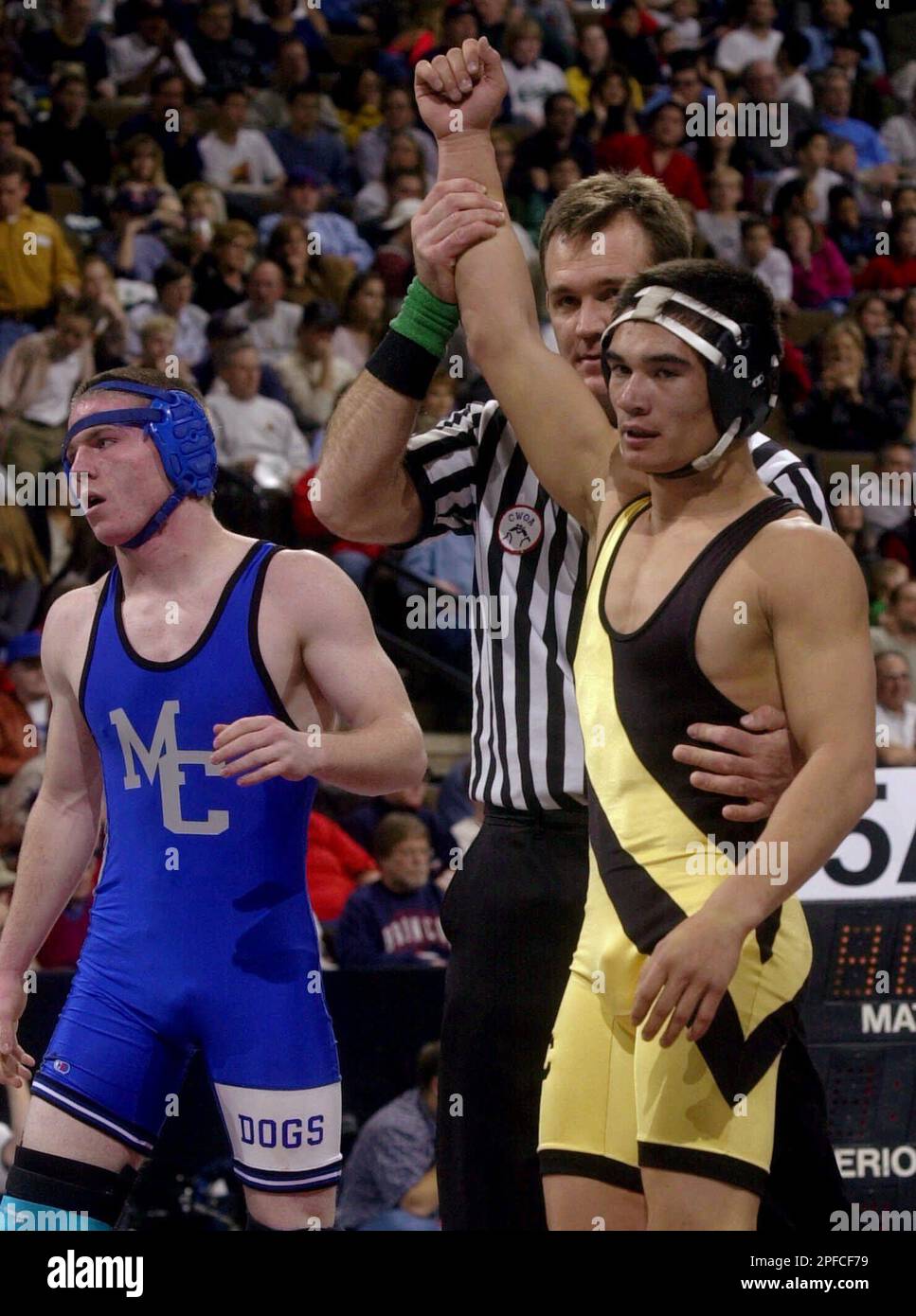 Canon City's Blaine Brown, right, has his arm raised in victory after ...