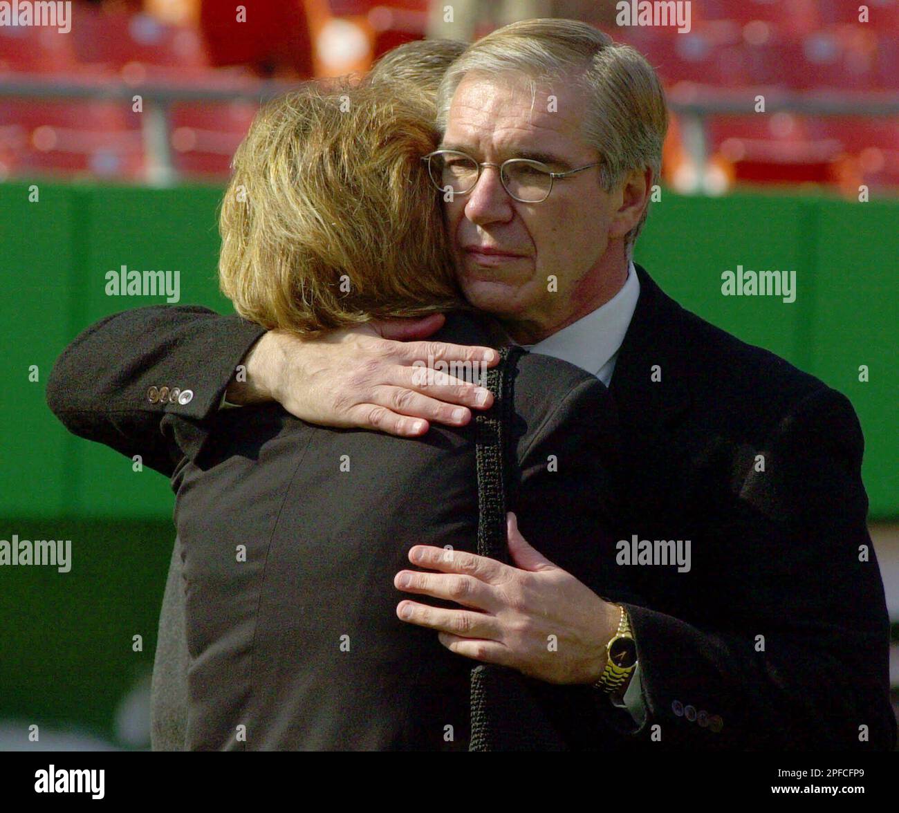 Kansas City Chiefs head coach Gunther Cunningham hugs his wife Renee at ...