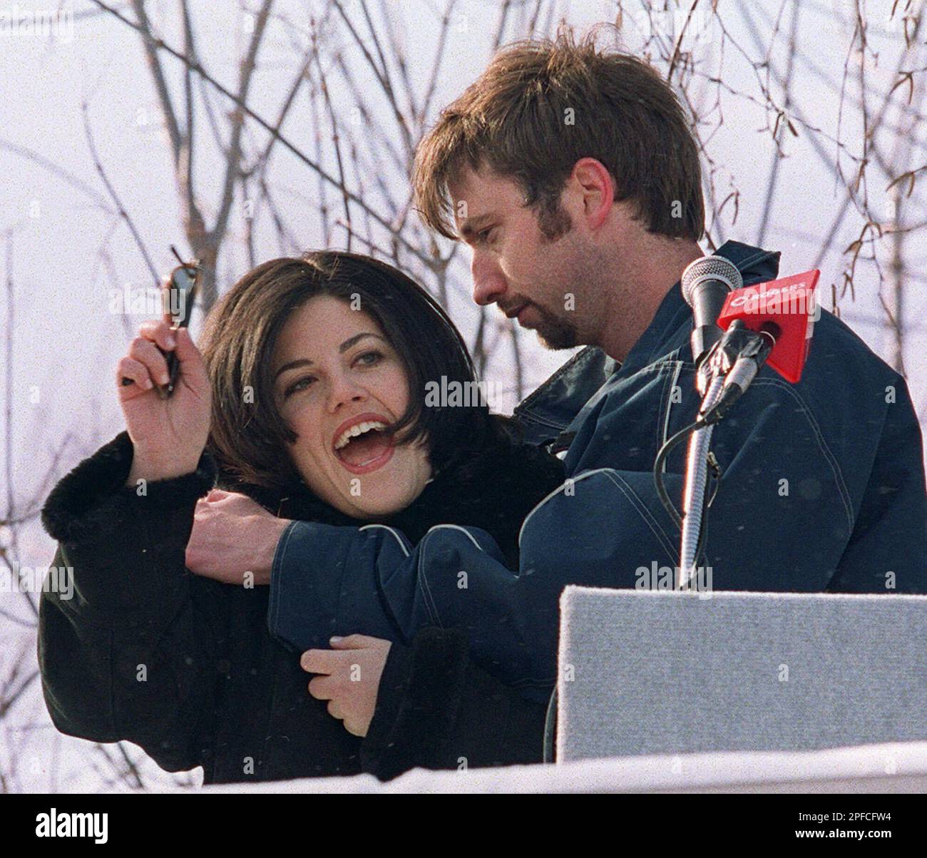 Canadian comedian Tom Green puts his arms around Monica Lewinsky as she ...