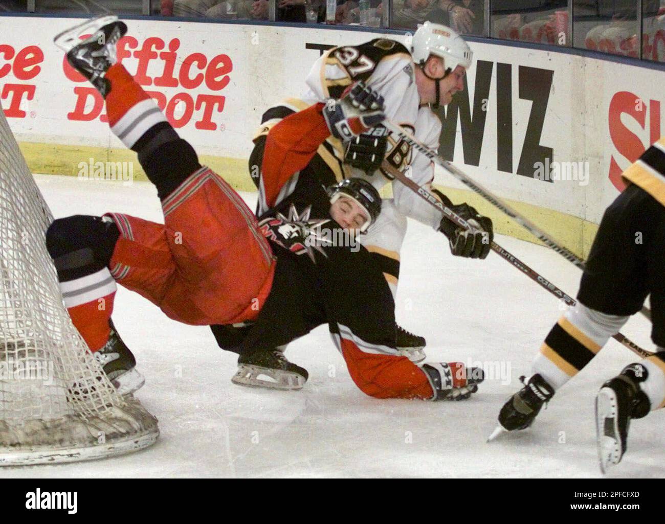New York Rangers left winger Eric Lacroix loses his feet while battling ...