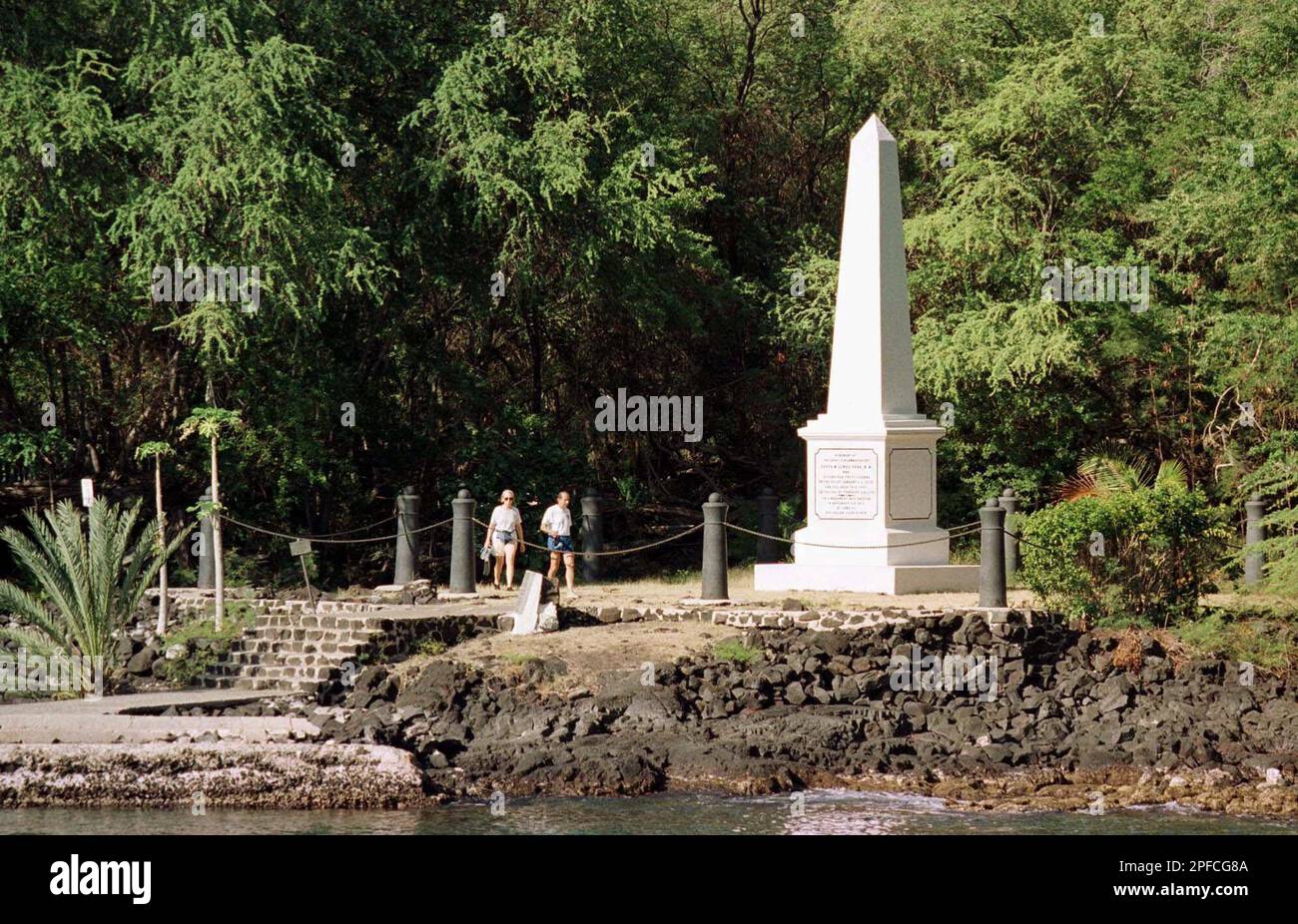 Visitors walk near the Captain Cook monument on the shore of Kealakekua ...