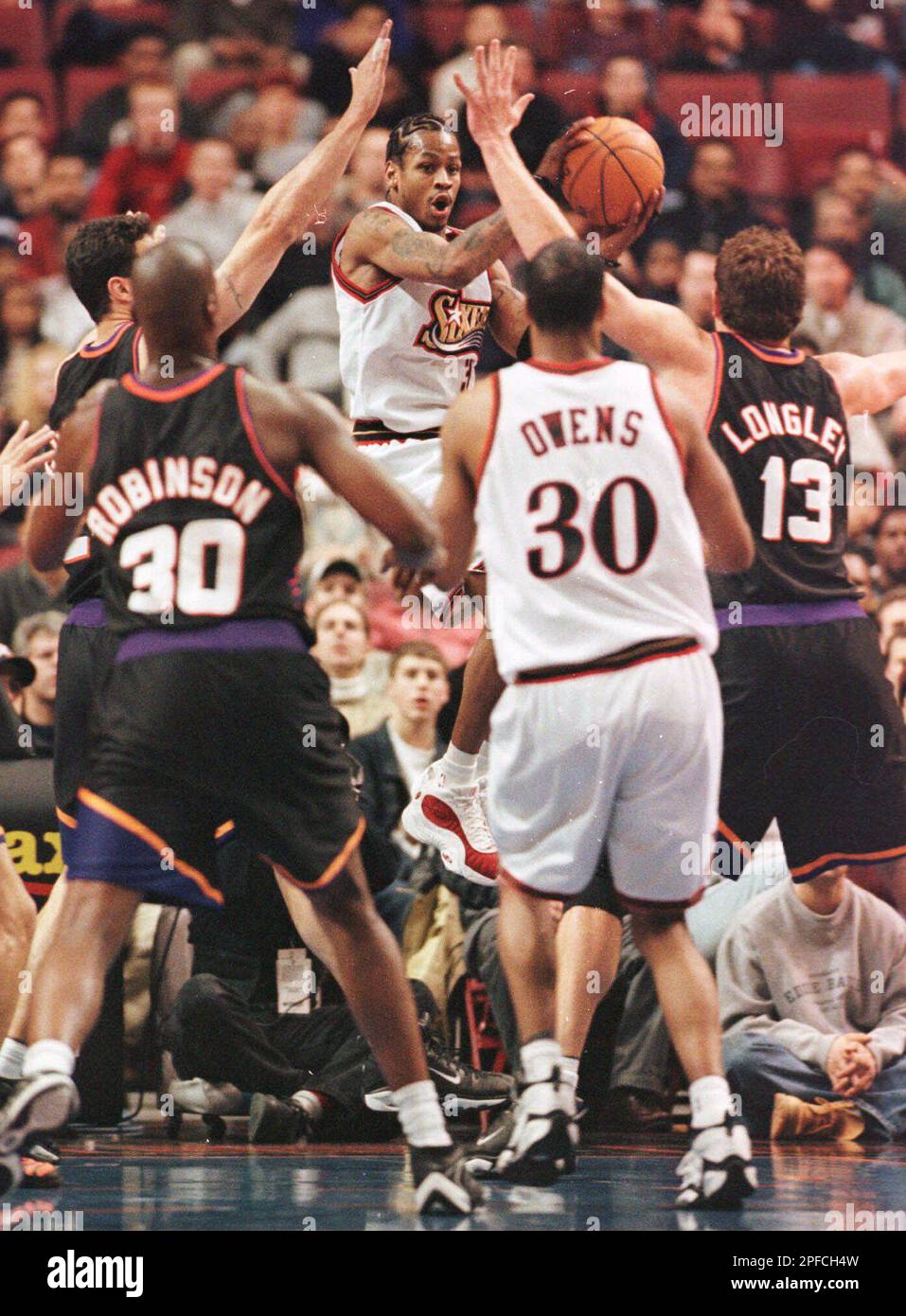 Philadelphia 76ers' Allen Iverson flies through the air under the ...