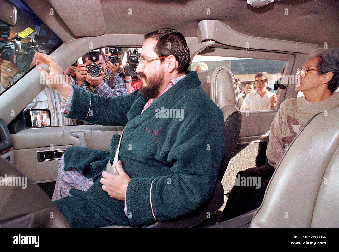 FILE-- Roman Catholic priest Mario Orantes Najera, left, is accompanied ...