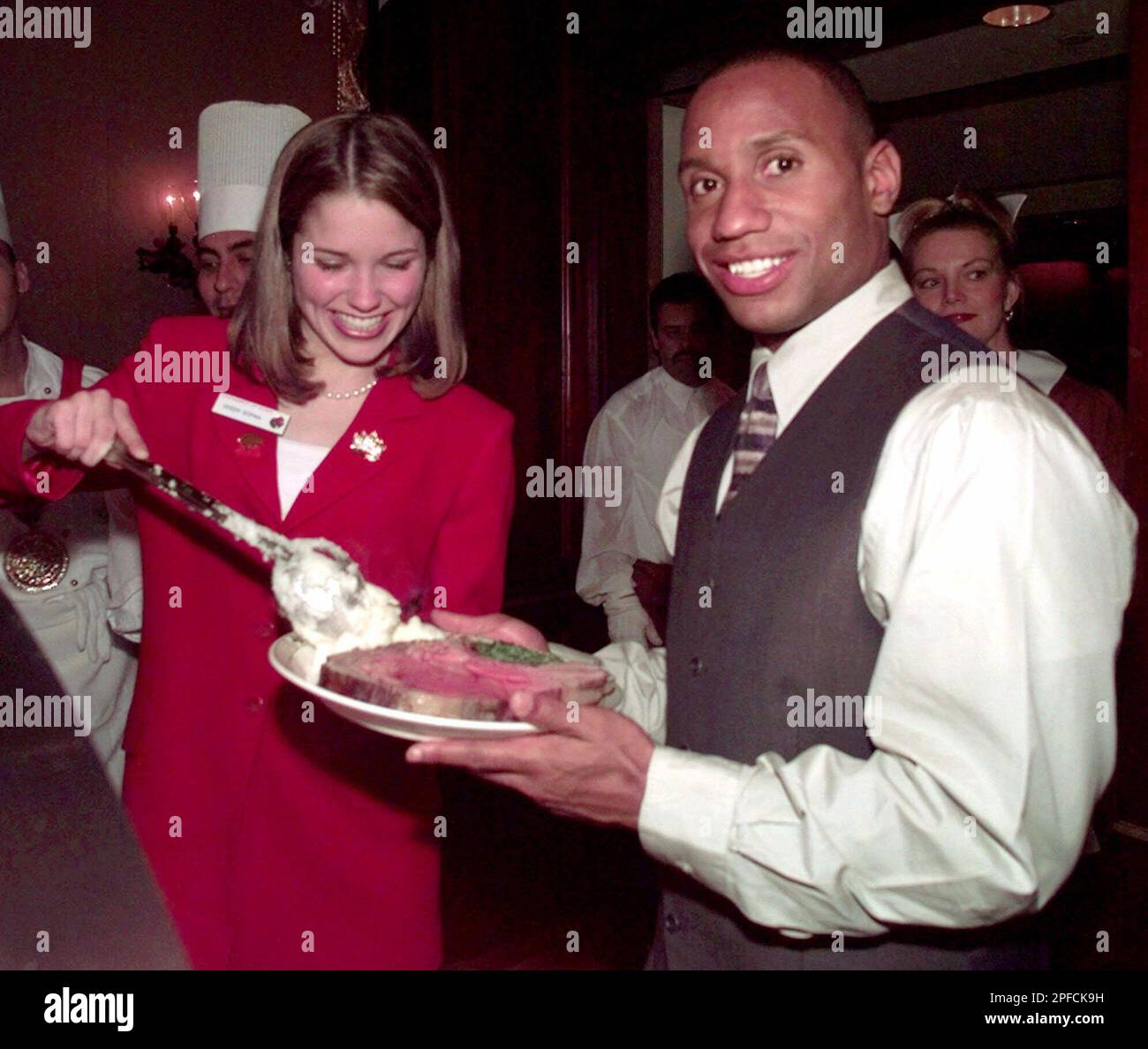 The 82nd Rose Queen Sophia Bush, left, serves up some prime rib and ...