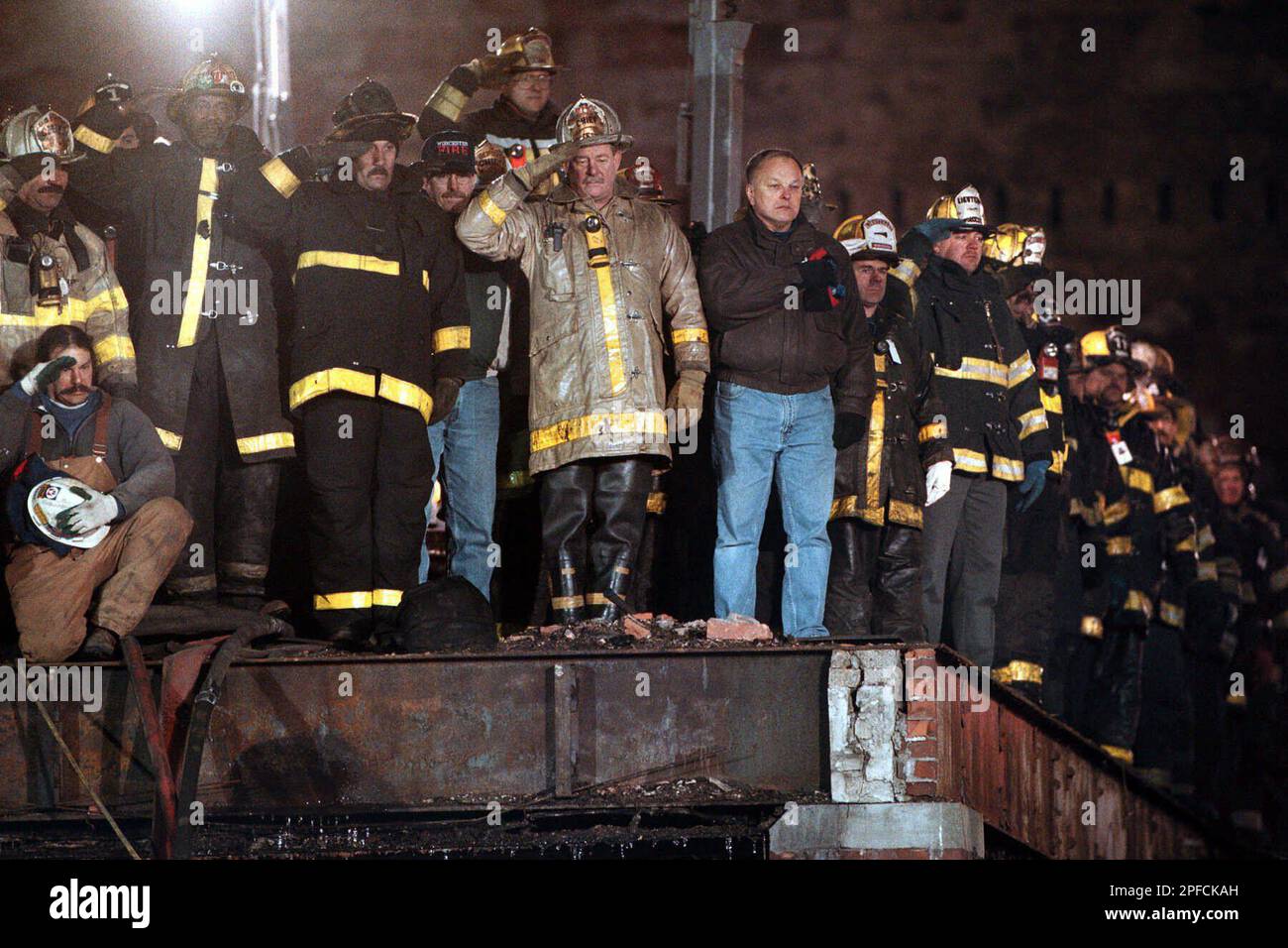 Worcester City Manager Thomas Hoover, center right, joins a line of ...