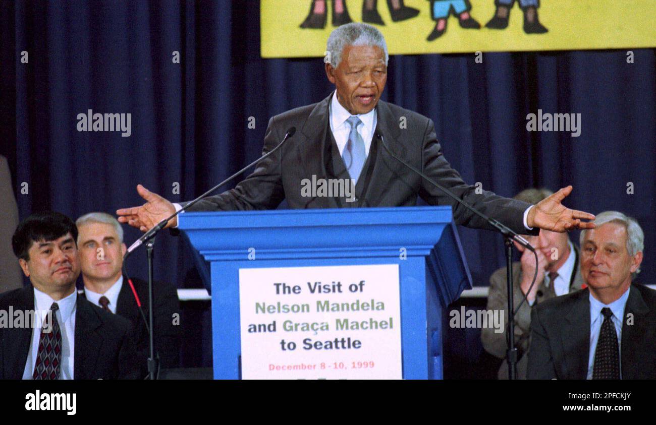 Nelson Mandela, center, speaks to a group of students after his arrival ...