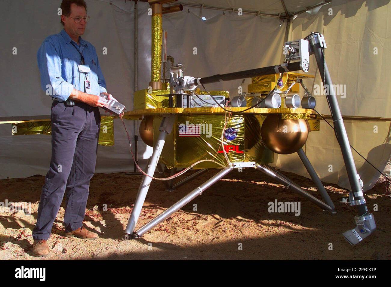 Wayne Zimmerman, a member of NASA's robotic arm team demonstrates the ...