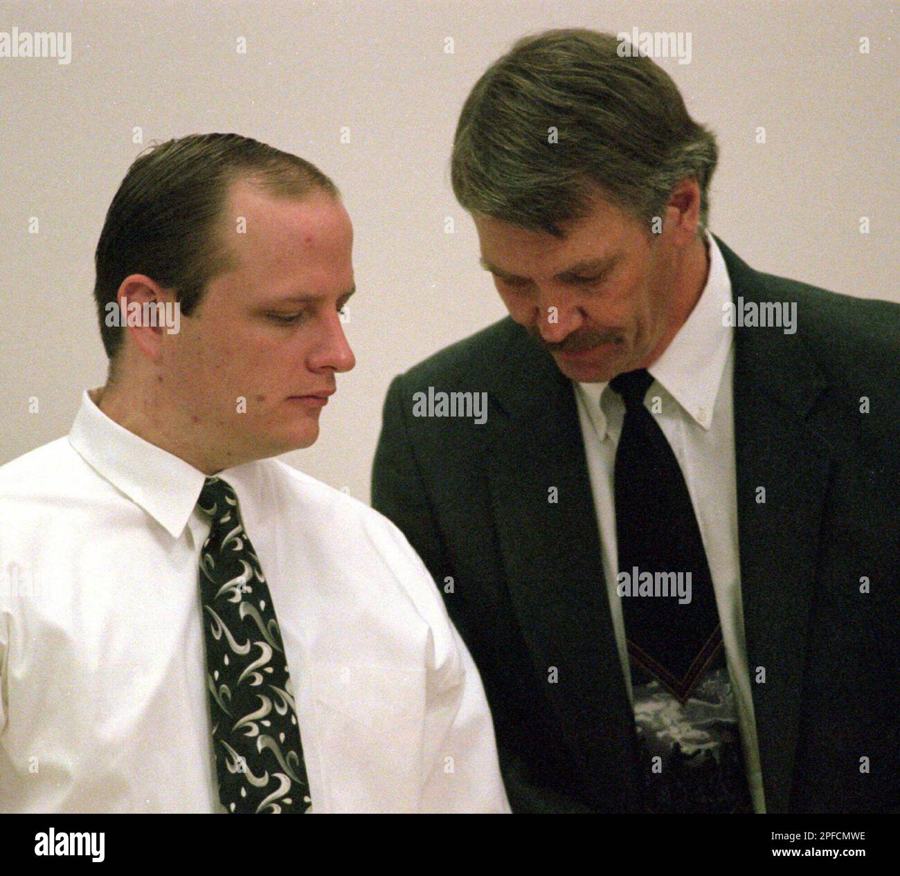Defendant Jason Desnoyers, left, confers with his defense lawyer Gary ...