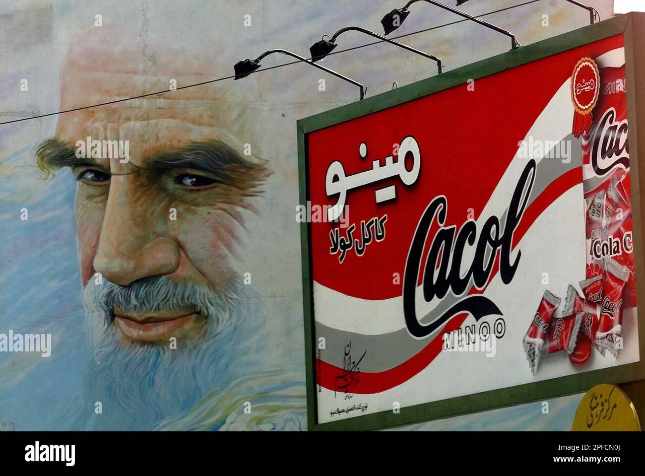 A giant mural of the late Ayatollah Ruhollah Khomeini appears to gaze ...