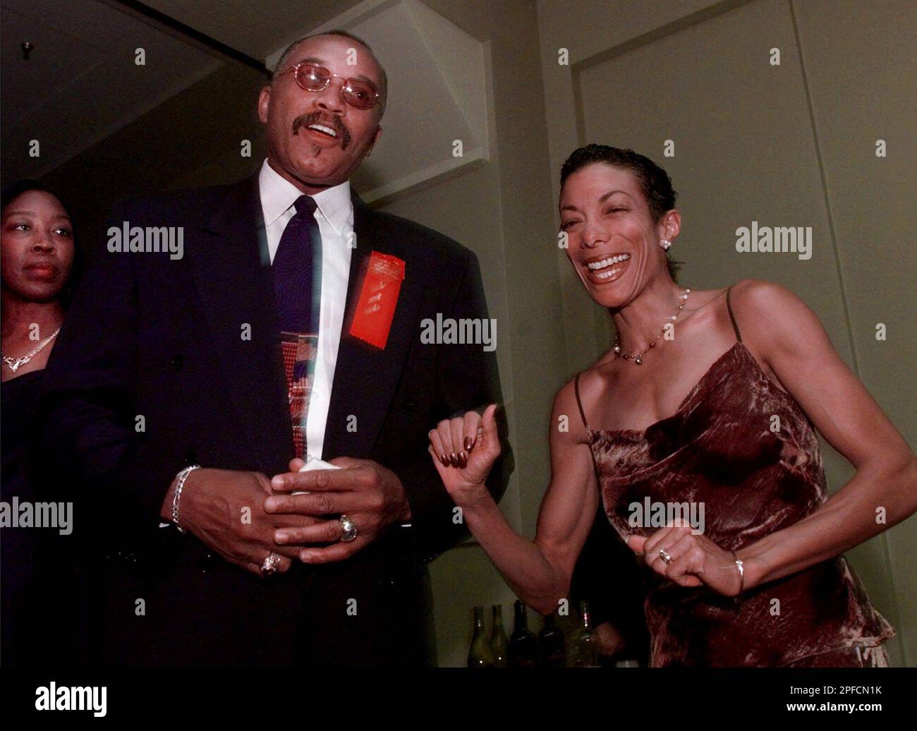 Olympic gold medalist Tommie Smith, left, and Regina Jacobs, right, one ...