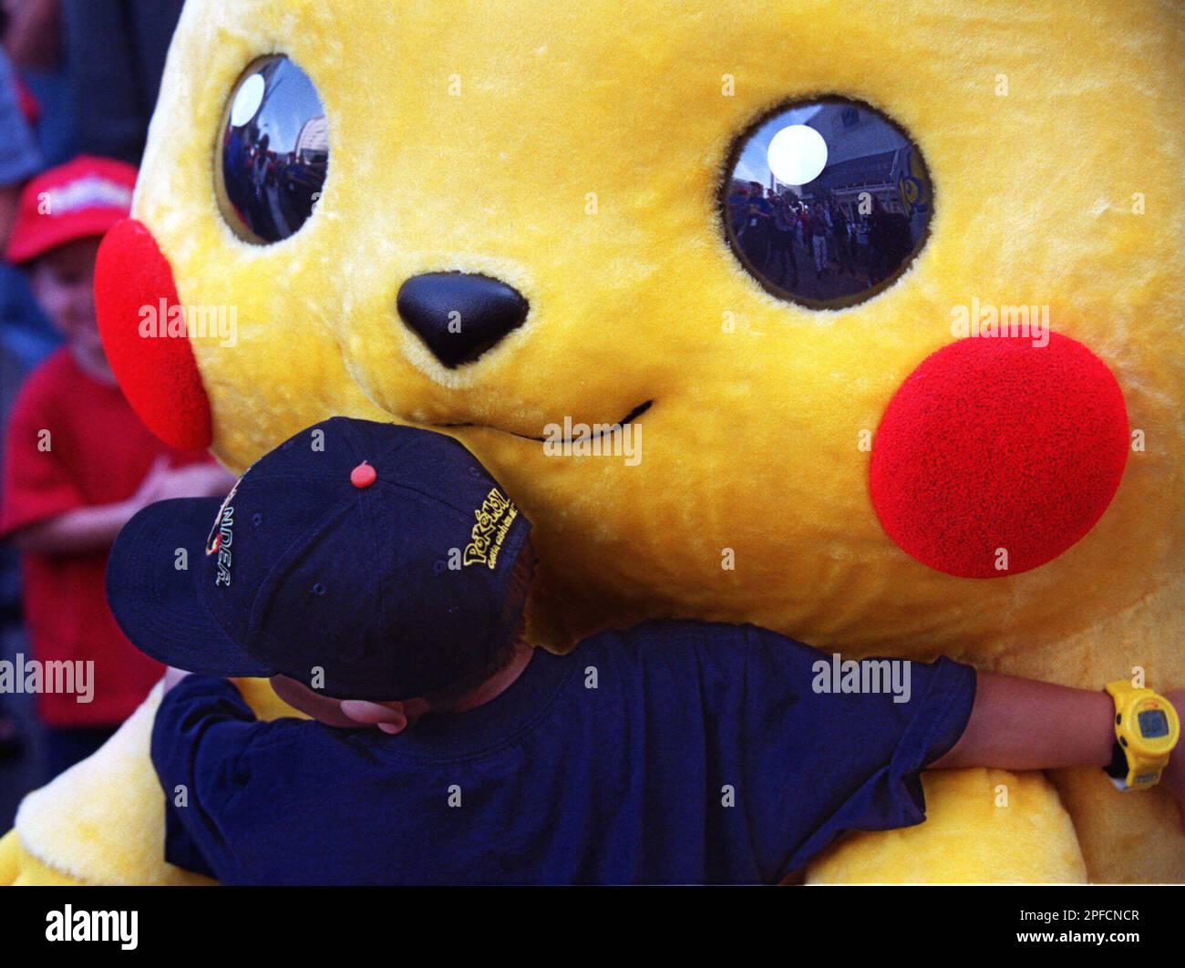 Daniel Osugi, 7, of Long Beach, Calif., hugs an oversized Pokemon ...