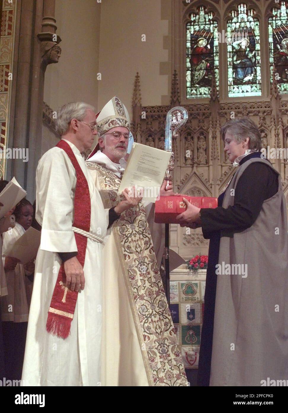 The Rt. Rev. Andrew Donnan Smith, center, takes the oath of office at ...
