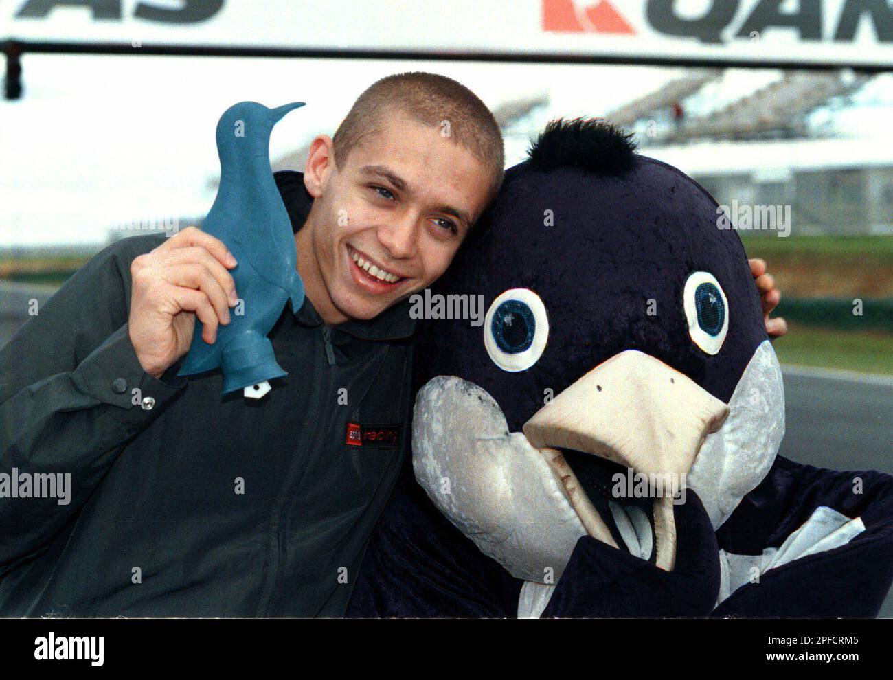 Italian 250cc Grand Prix rider Valentino Rossi meets a penguin mascot ...