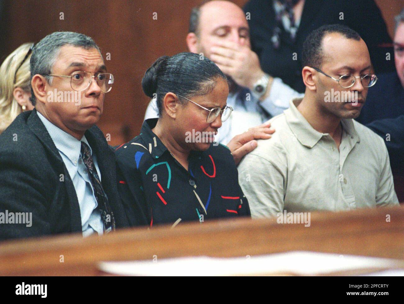 Unidentified family members of Gladys Ricart, in front row, watch with ...
