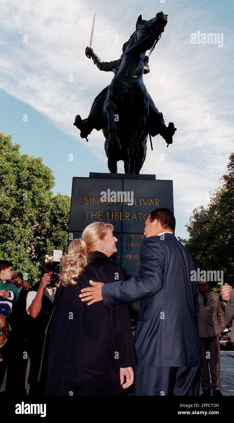Venezuelan President Hugo Chavez and his wife Marisabel pause after ...