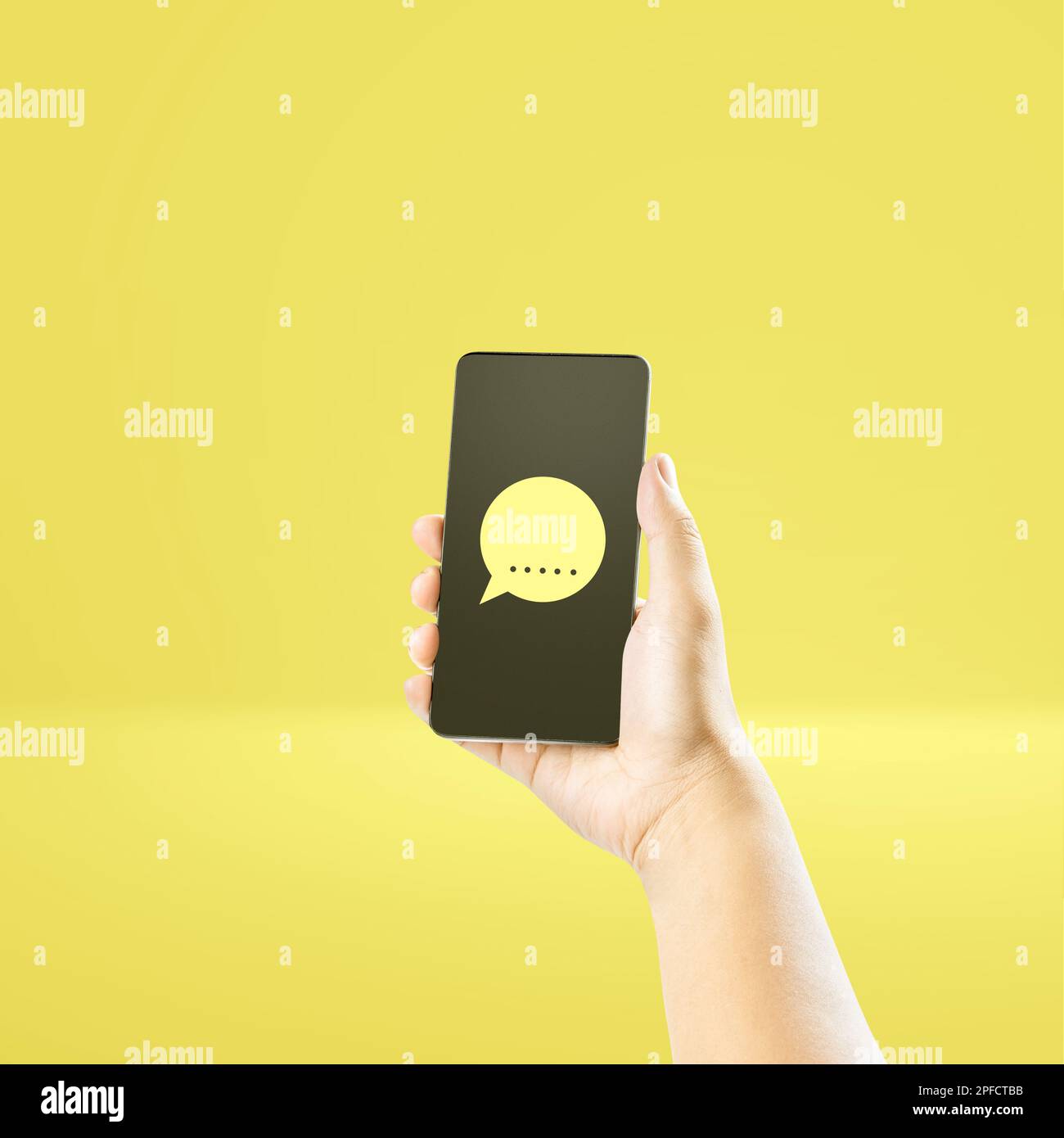 Human hand holding mobile phone screen with message notification symbol ...