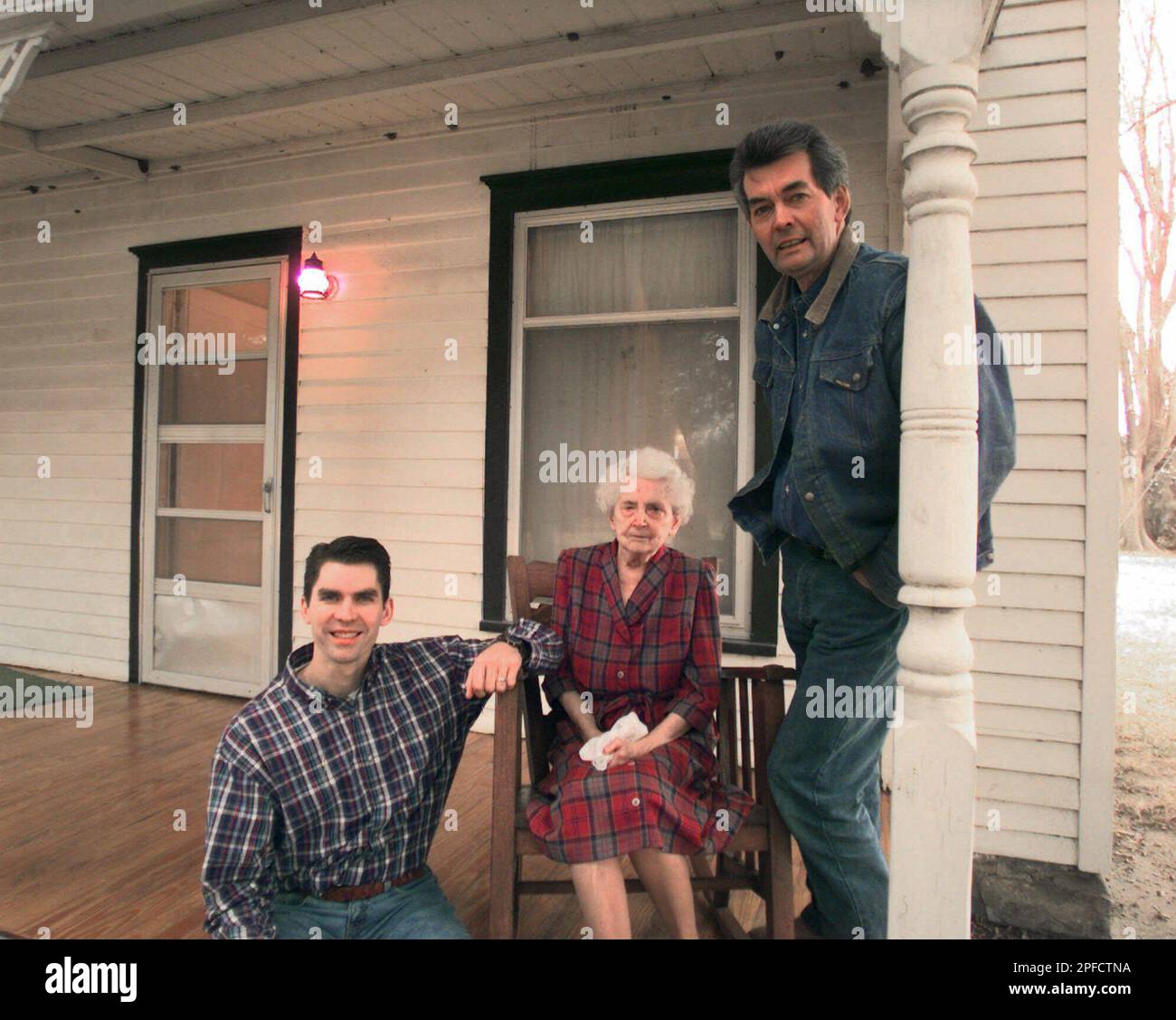 Three generations of the Stucky family pose on the front porch of their ...