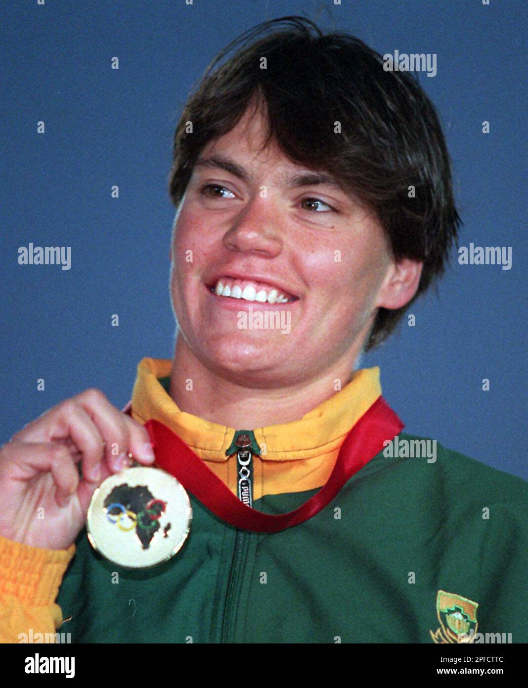 South Africa's Penny Heyns hold her gold medal at the All Africa Games ...