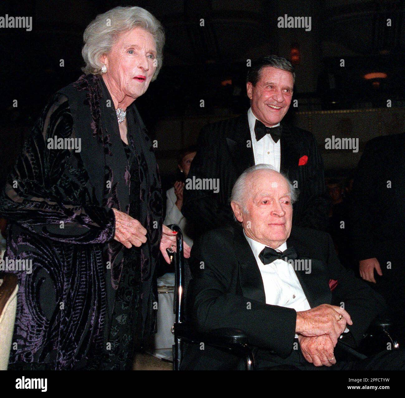 Legendary entertainer Bob Hope, seated, joins his wife, Dolores, as ...