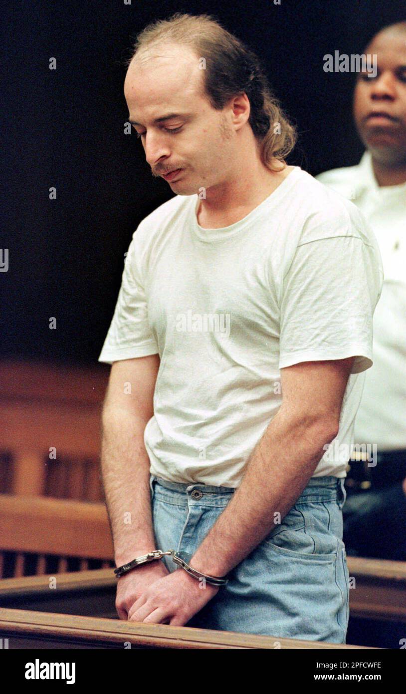 Michael Gentile, of Falmouth, Mass., bows his head as charges are read during his arraignment ...