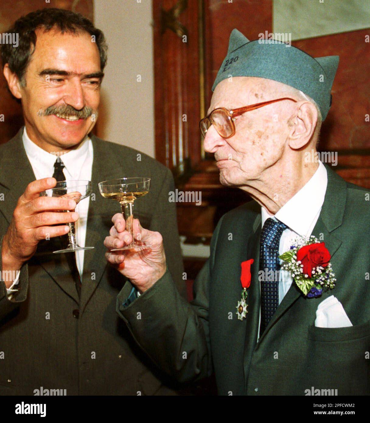 World War I veteran Gustave Streeter, 103, right, is toasted by Consul ...