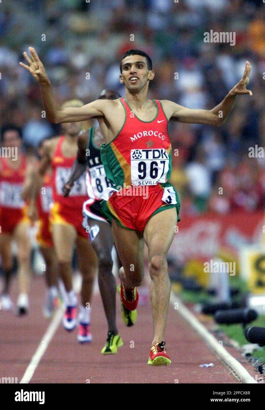 Morocco's Hicham El Guerrouj celebrates as he wins the gold medal in ...
