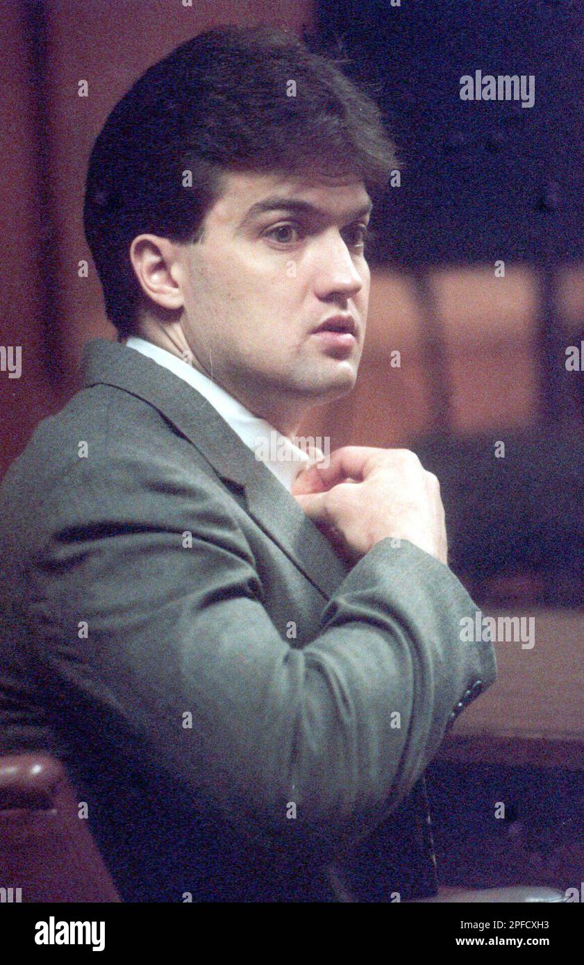 Jonathan Schmitz adjusts his tie before the start of his retrial in the ...