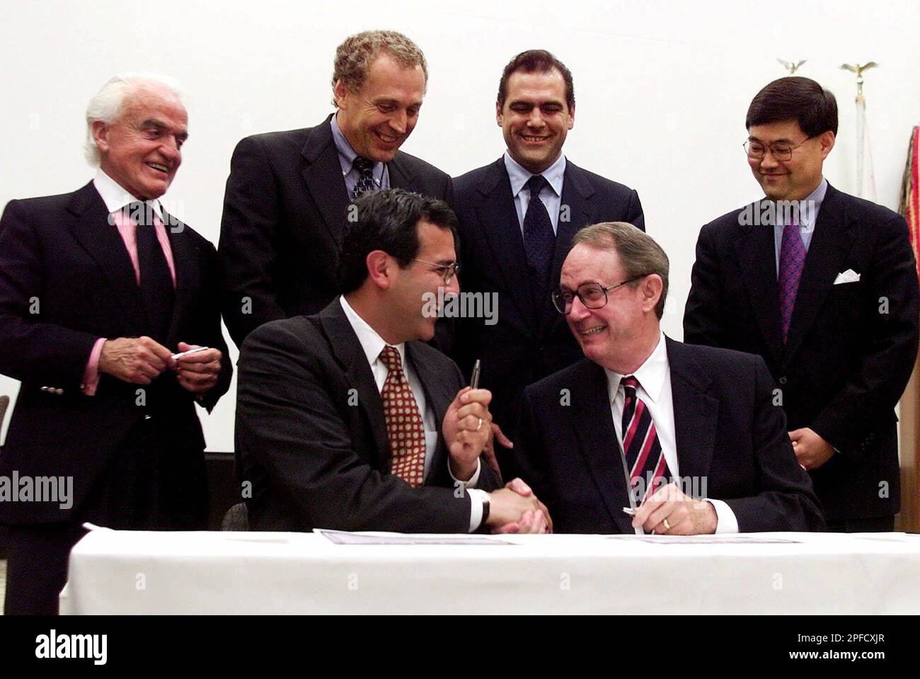 Secretary of the Army Louis Caldera, left, and University of Southern ...